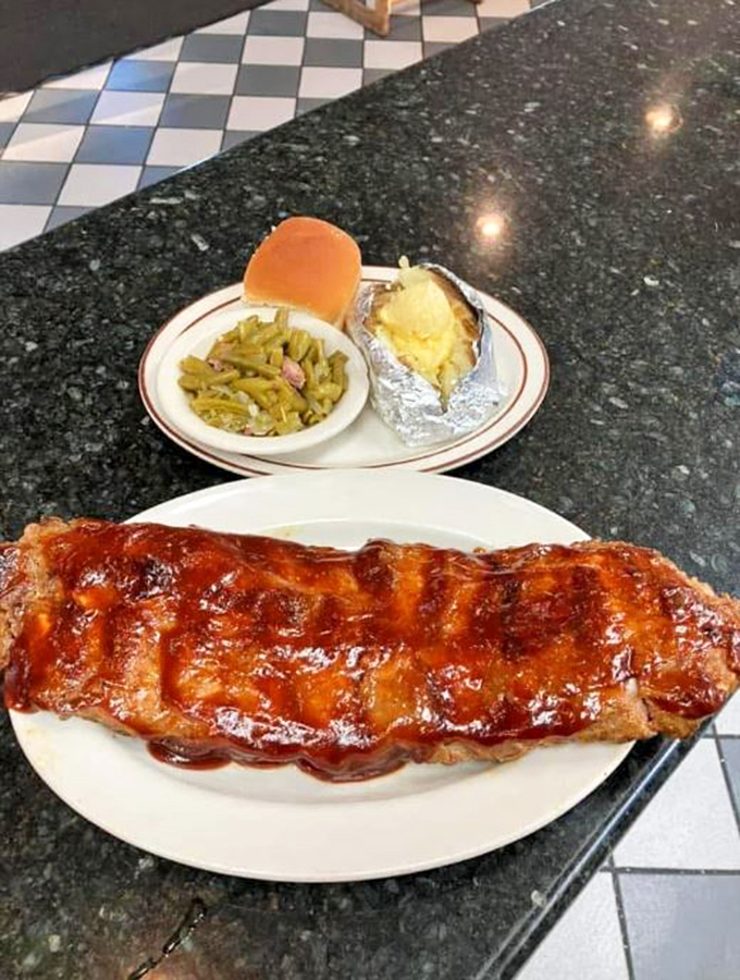 Ribs so tender they practically surrender to your fork before you even touch them. That glossy BBQ sauce means business&mdash;delicious, sticky business. 