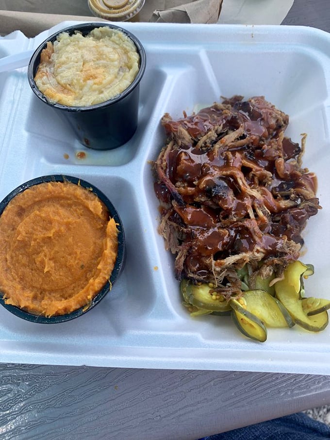 Sweet potato side, mac and cheese, and saucy pulled pork &ndash; the holy trinity of Southern comfort on a single tray.
