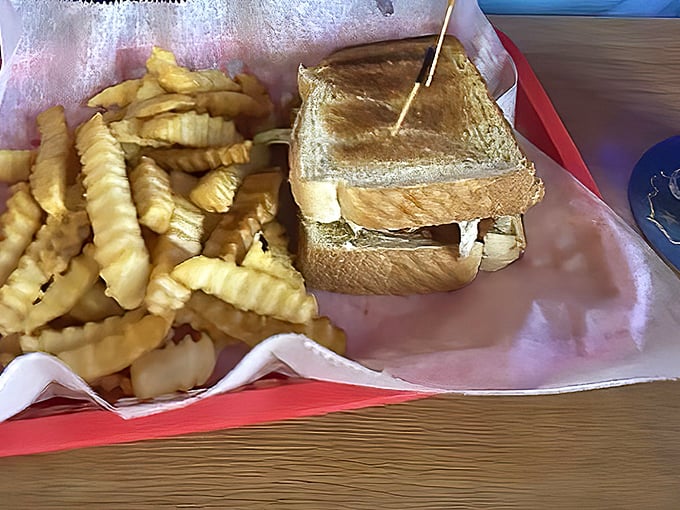 The humble BLT elevated to art form. Golden toast holding the perfect ratio of bacon, lettuce and tomato&mdash;proof that classics never go out of style.