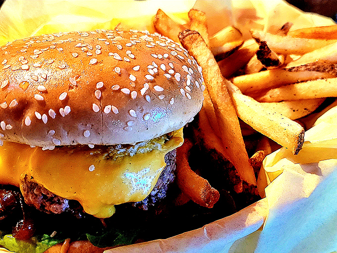 The wooden skewer isn't for show&mdash;it's structural support for this towering achievement in burger engineering. Each layer contributes to the symphony of flavors.
