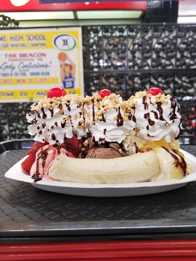 This banana split isn't dessert; it's performance art with whipped cream, cherries, and enough toppings to make your dentist buy a vacation home.