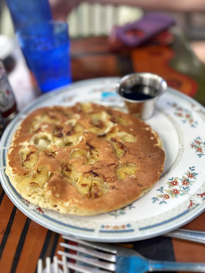 These banana pancakes have more personality than most people you'll meet today. That little cup of syrup is just waiting for its big moment.