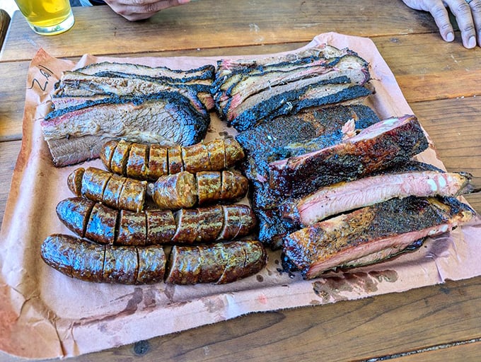 The barbecue platter that launched a thousand Instagram posts. Sausage and brisket sharing butcher paper real estate like delicious roommates.