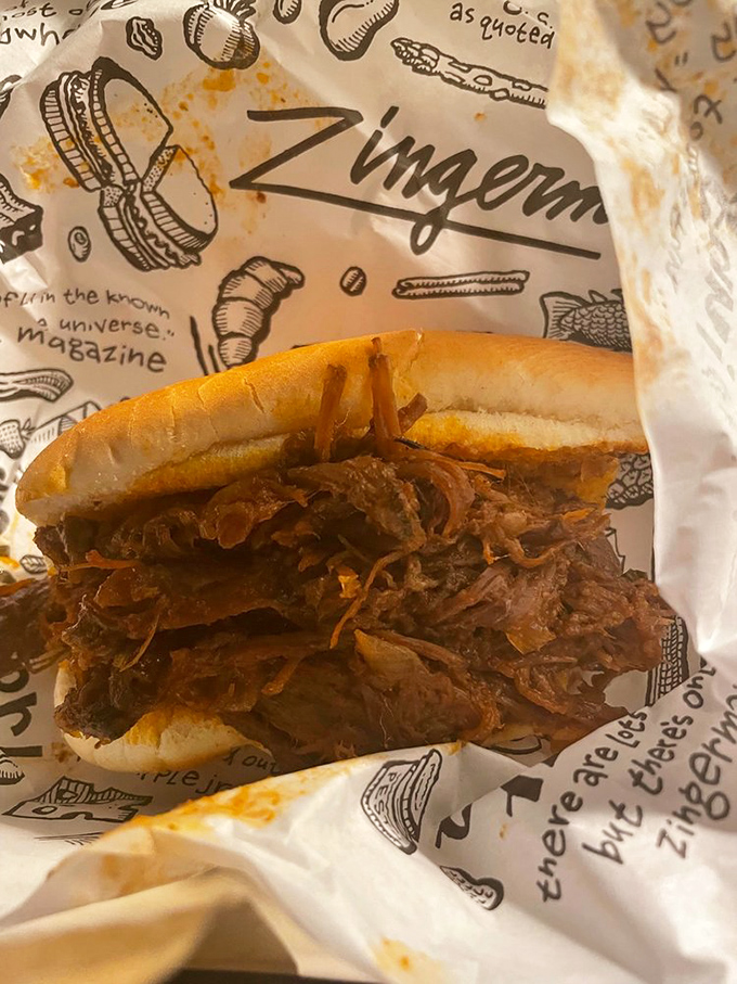 BBQ brisket nestled in a soft roll&mdash;where smoke meets sweet in a relationship your taste buds will want to third-wheel.