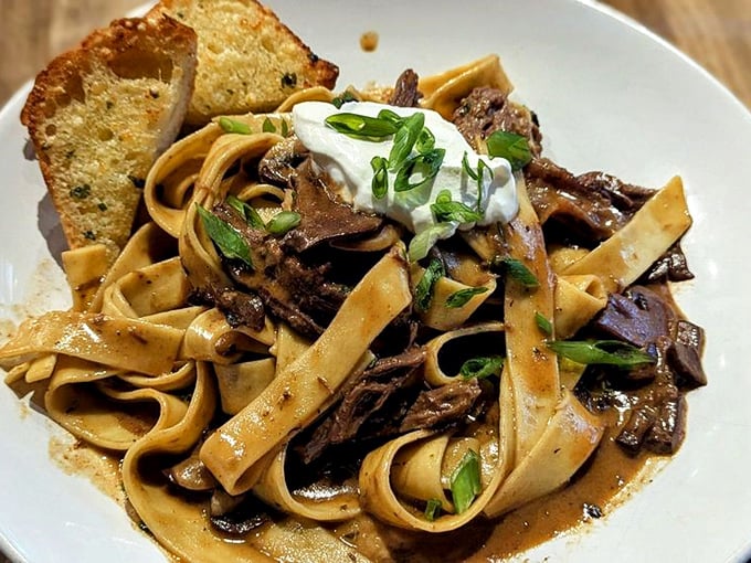 Beef stroganoff that would make a Russian grandmother nod in approval. Tender beef, silky noodles, and a sauce worth sopping up with that garlic toast.