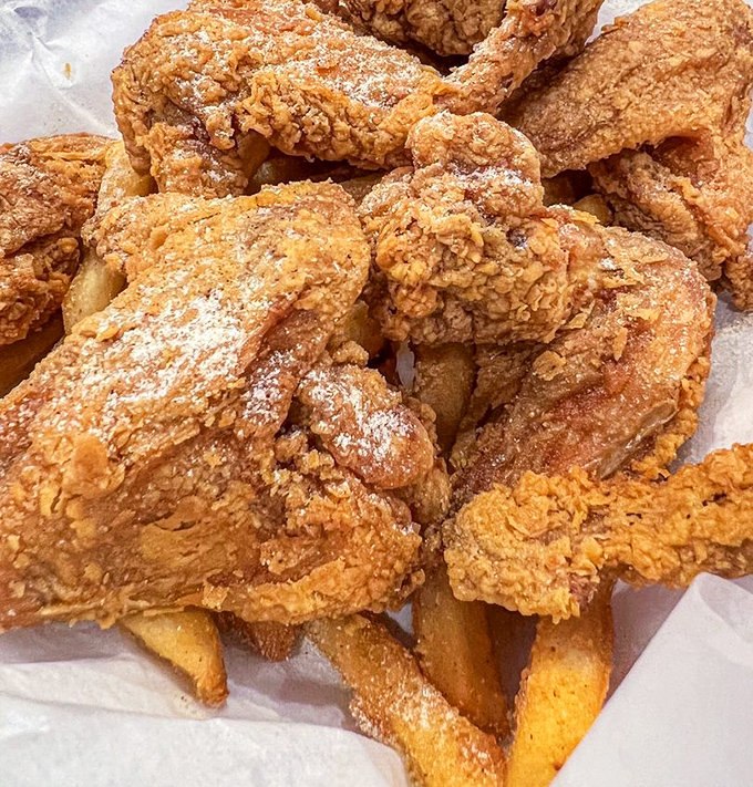 The holy trinity of Harold's: crispy chicken, golden fries, and that sauce that makes everything better. Diet plans come here to die gloriously.