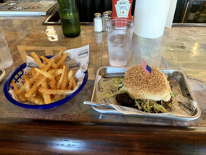 Exhibit A in the case for why diet starts tomorrow: a perfectly cooked burger with all the fixings alongside crispy potato heaven.