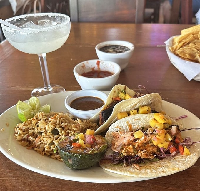Tacos that don't just sit on your plate &ndash; they perform. The mango salsa and purple cabbage create a fiesta of color worthy of their flavor.