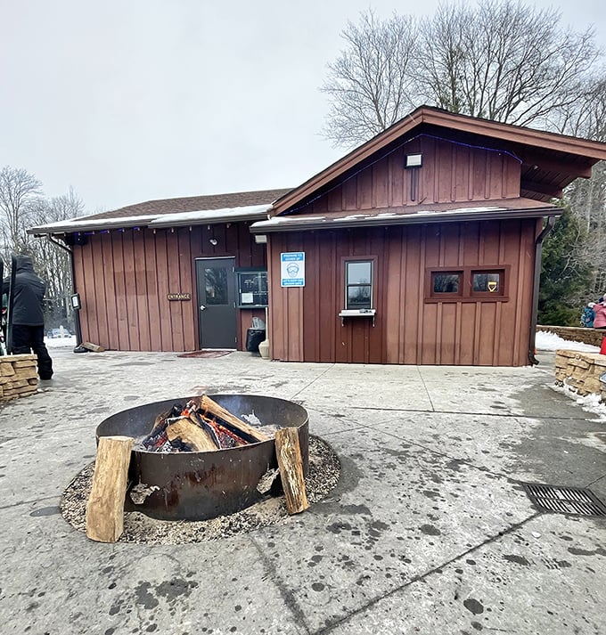 Nothing says "embrace winter" quite like a crackling fire pit outside a cozy warming hut after a day on the cross-country trails.