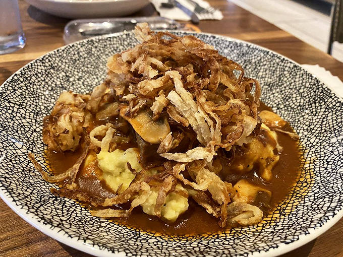These boneless short ribs swimming in rich gravy with mashed potatoes and crispy onions are what comfort food dreams are made of.
