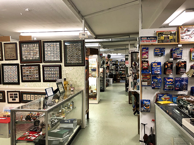 Booth 79 showcases the organized madness of collecting. Those framed stamps and collectible cards represent someone's passion, now awaiting yours.
