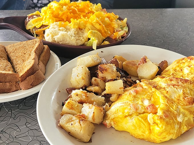 A breakfast platter so loaded with golden eggs, crispy potatoes, and buttery toast that your cardiologist might just call to check in.
