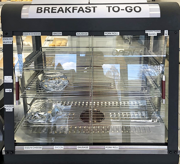 The breakfast sandwich warmer stands ready for the morning rush, promising portable protein to balance out your inevitable donut indulgence.