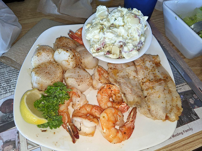 The seafood trifecta: scallops, shrimp, and fish with potato salad. A broiled masterpiece that makes calorie-counting seem like a crime.