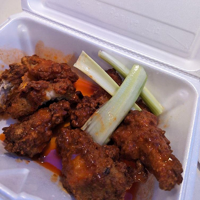 Buffalo wings that don't mess around—the kind that make you reach for both napkins and your phone to text friends about what they're missing.