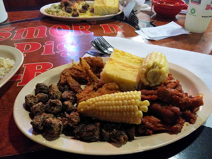 The buffet plate of champions: cornbread, fried okra, and enough protein to fuel a small tractor pull. Sunday dinner, any day of the week.