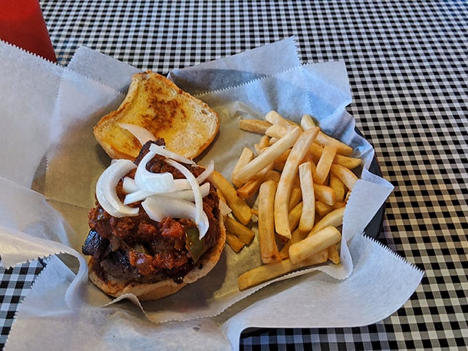 The classic American trinity&mdash;burger, fries, and Texas toast&mdash;presented on checkered paper with zero pretension and maximum satisfaction.
