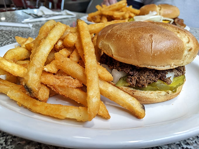 Sometimes happiness is as simple as a perfectly proportioned burger and a pile of fries that manages to be both crispy and fluffy.