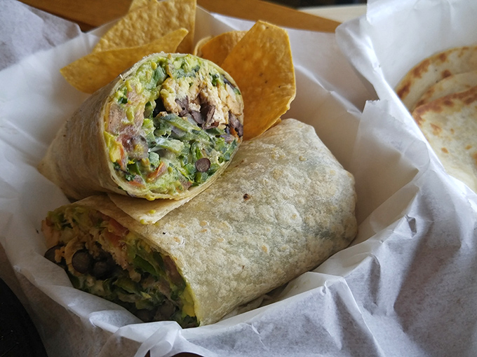 The burrito's faithful sidekick&mdash;house-made tortilla chips&mdash;stands ready to assist with any salsa overflow situations. A dynamic duo of deliciousness.