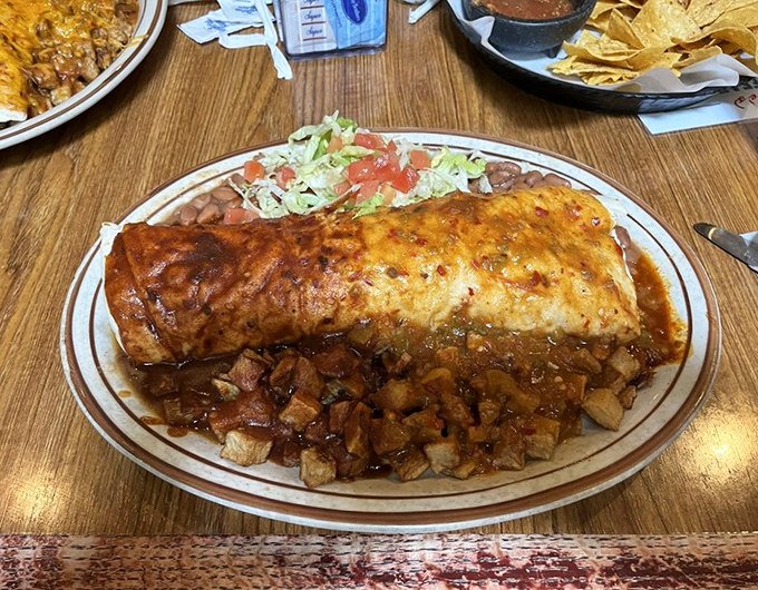 This burrito isn't just smothered in red chile sauce&mdash;it's having a full-on spa treatment in it. Pure New Mexican bliss.