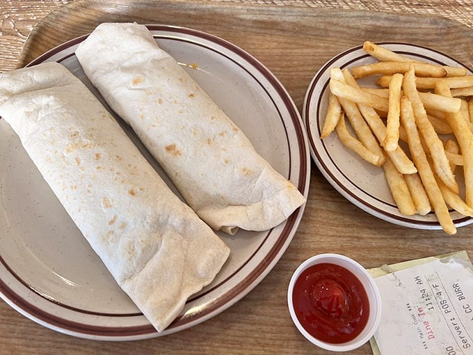 These burritos aren't just wrapped, they're swaddled&mdash;like precious food babies bundled in flour tortilla blankets next to golden fries.