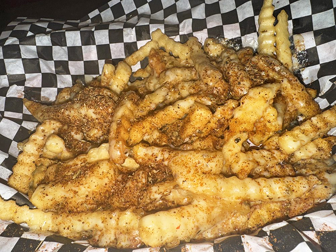 These aren't just fries&mdash;they're a crispy, seasoned intervention for your boring day. Served on checkered paper because some traditions just make sense.