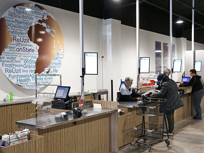 The checkout area features an artistic globe design that reminds shoppers their purchases support global initiatives. Shopping with purpose never looked so good.