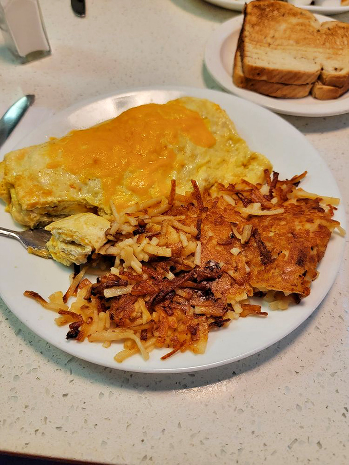 The golden marriage of fluffy omelet and crispy hash browns&mdash;a breakfast power couple that's been making mornings bearable since time immemorial.