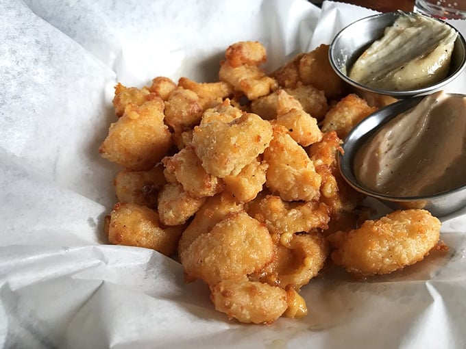 Cheese curds that would make a Frenchman weep. These golden nuggets aren't just fried cheese &ndash; they're little pieces of Wisconsin's soul.