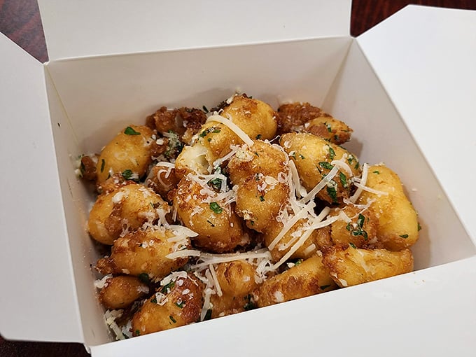 Cheese curds that squeak with personality. These golden nuggets of joy are what happens when dairy decides to dress up for a night out.
