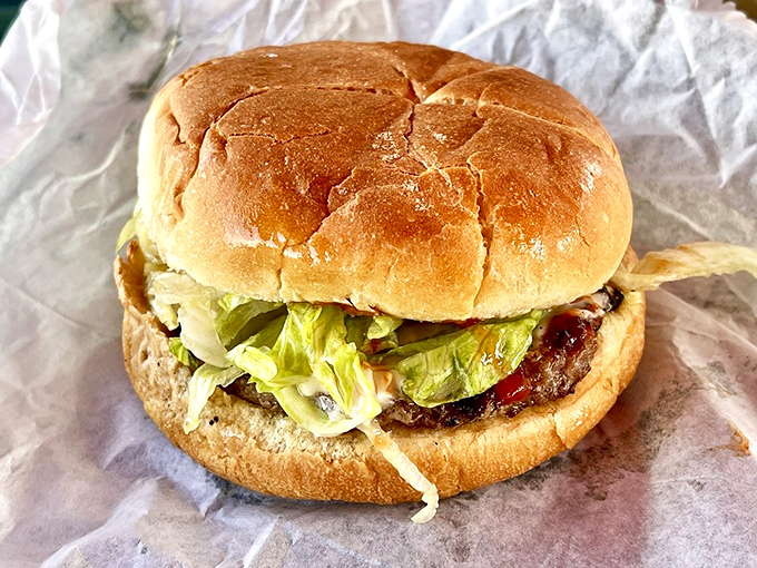 This isn't just a cheeseburger; it's a manifesto against pretentious $20 burgers that come with everything except satisfaction.