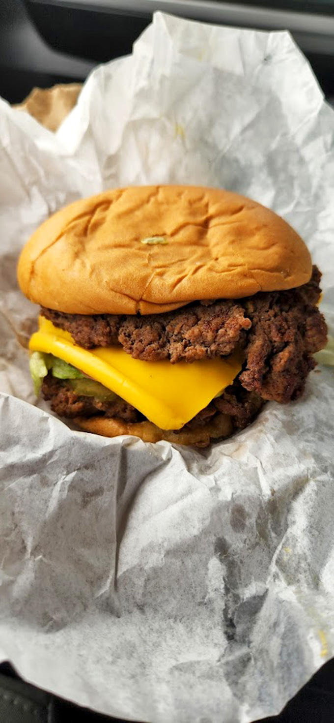 The classic cheeseburger in its natural habitat&mdash;wrapped in paper, ready to transport you to a simpler, more delicious time.
