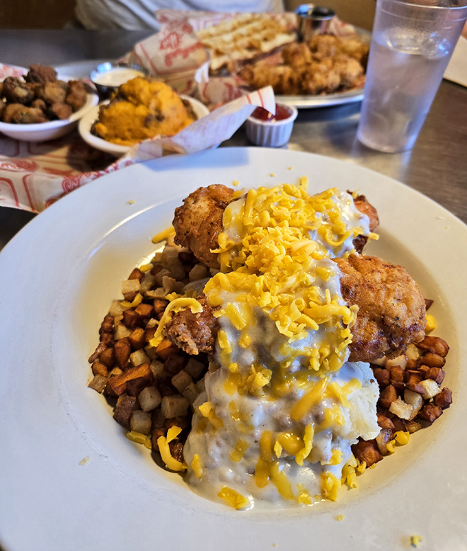 Chicken and potatoes having a party under a blanket of cheese and gravy. Diet plans weep softly in the distance.