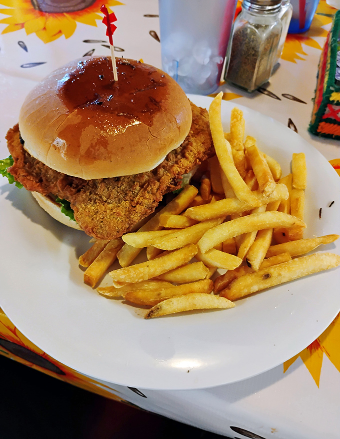 The chicken sandwich that makes you question city living. Crispy, golden-fried perfection on a pillowy bun with fries that demand equal attention.
