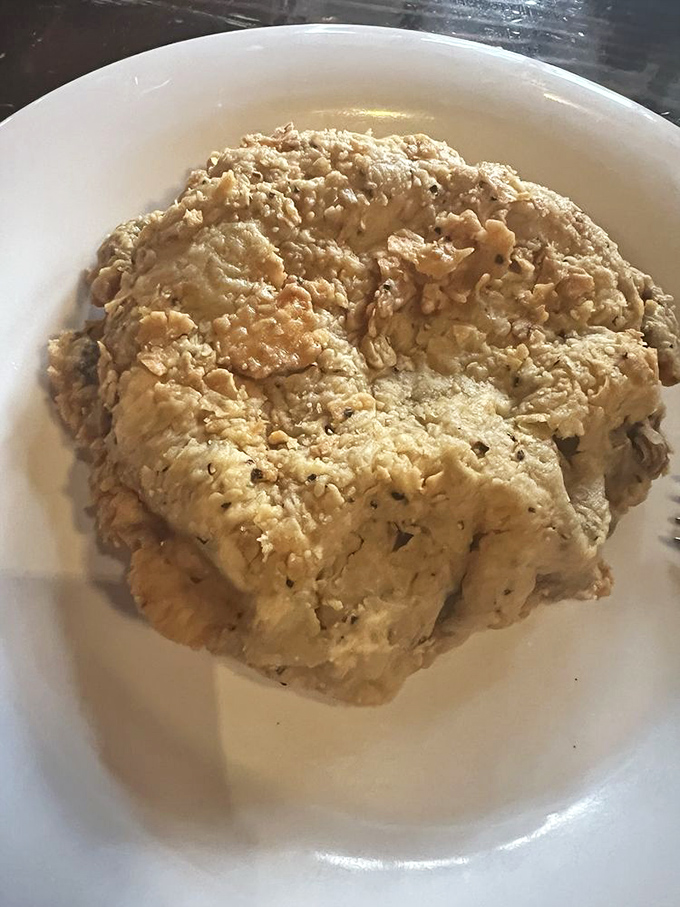 This isn't just chicken fried steak &ndash; it's a Texas-sized cloud of crispy, savory heaven that makes vegetarians question their life choices.