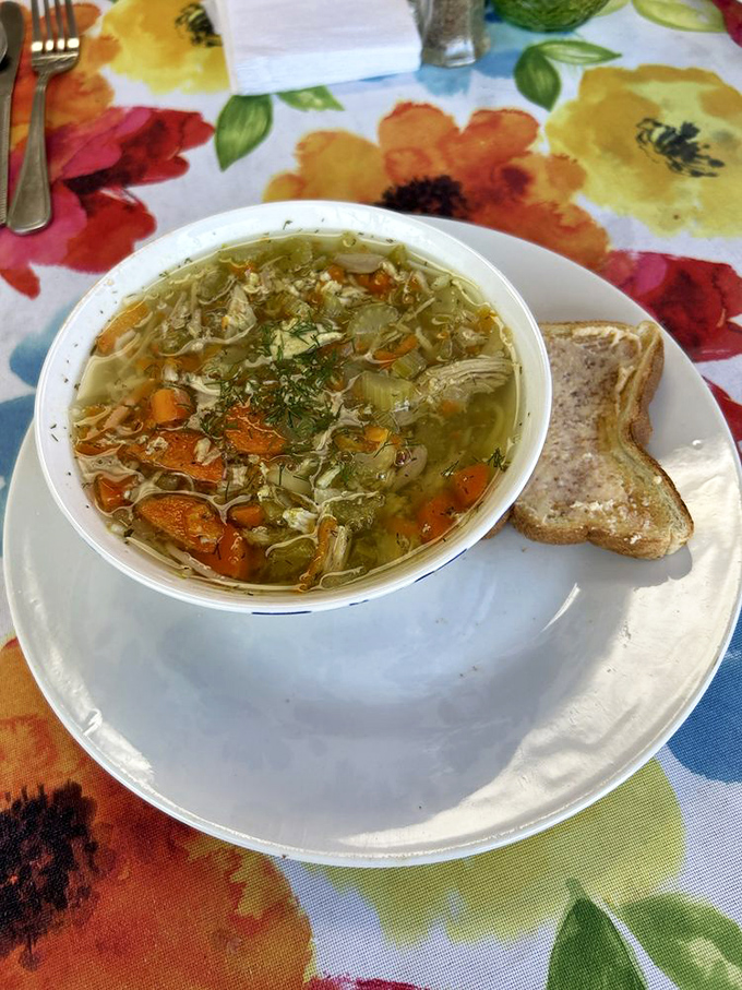 Chicken soup that could cure anything from a cold to a bad day. Clear broth, tender vegetables, and love in every spoonful.