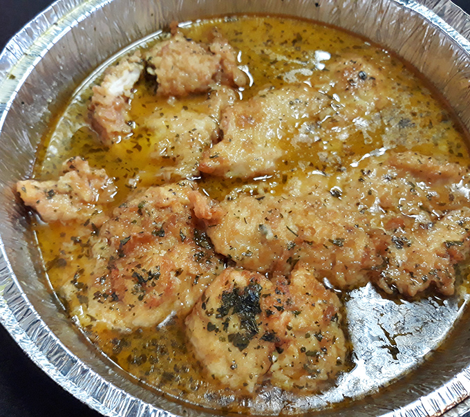 Chicken swimming in a buttery, garlicky bath of goodness. Vesuvio might be Italian for "I'll need to loosen my belt after this."