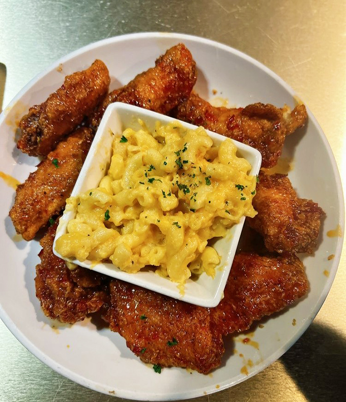 Crispy chicken wings surrounding mac and cheese like delicious bodyguards. The kind of comfort food that hugs you from the inside.