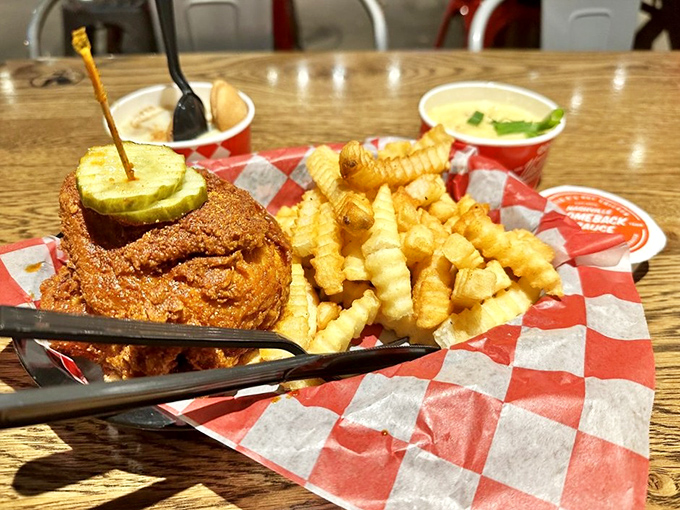 The pickle's not just decoration&mdash;it's nature's fire extinguisher, standing by while those perfect crinkle-cut fries provide moral support.