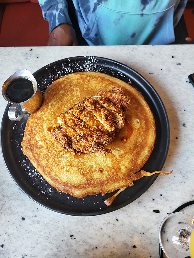 This isn't just breakfast, it's morning theater&mdash;golden-crisp chicken alongside a pancake so perfect it deserves its own standing ovation.