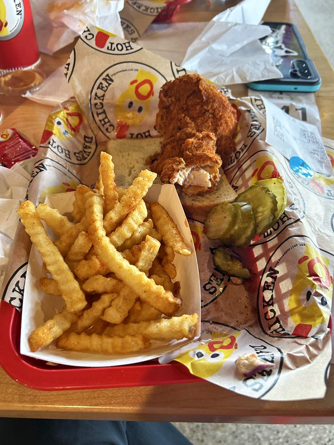 Comfort food architecture at its finest&mdash;crispy tenders nestled in soft buns with that signature sauce peeking out like a delicious secret.