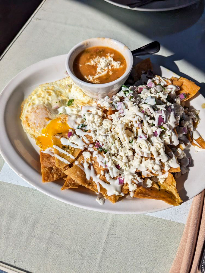 Chilaquiles that bring serious flavor to the breakfast table. That vibrant red sauce and crumbled cheese would cure any morning blues.
