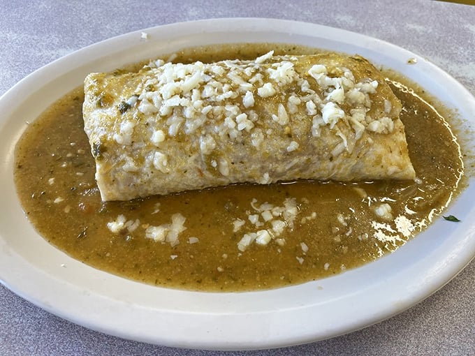 The chile relleno burrito—where a perfectly fried pepper finds itself wrapped in a tortilla blanket and bathed in green chile.