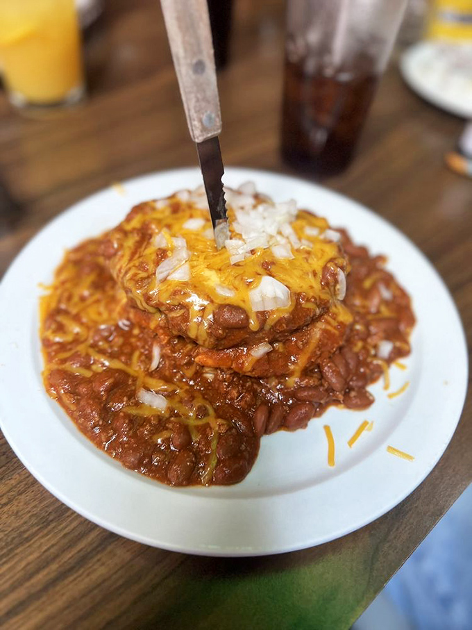 This isn't just chili&mdash;it's a masterclass in comfort. Topped with melted cheese and onions, it's the kind of dish that makes winter bearable.