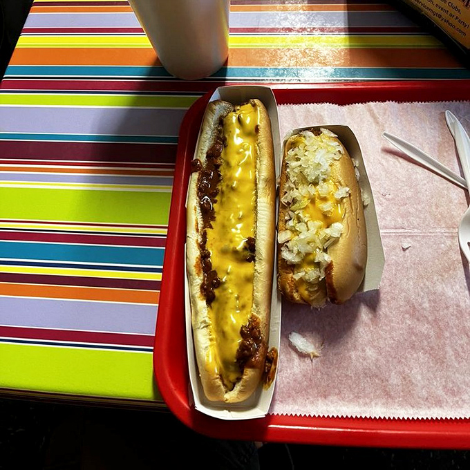 Two dogs, two styles, one happy meal. The cheese dog brings a golden blanket of comfort to an already perfect situation.