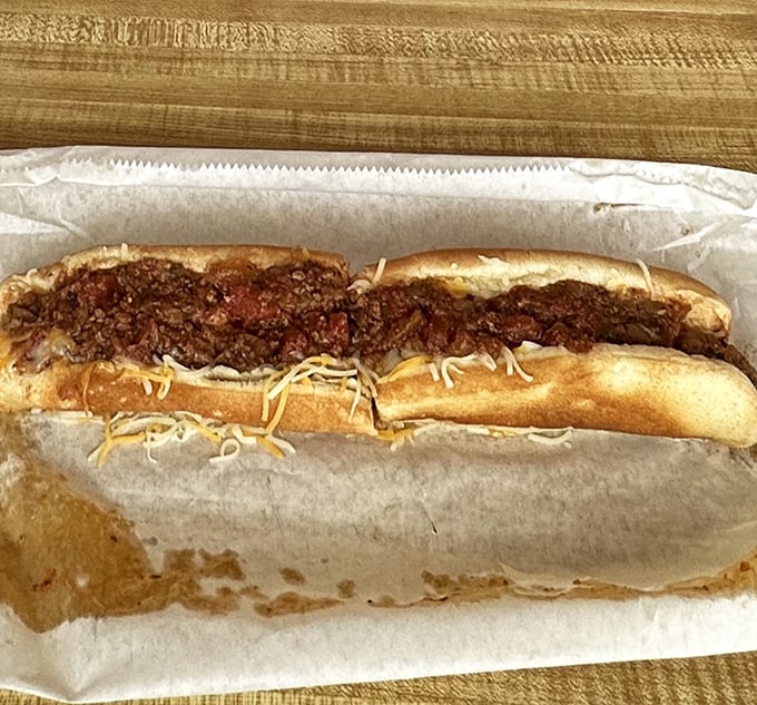 Behold the chili dog in all its messy glory &ndash; a reminder that the best foods require both napkins and a complete abandonment of dignity.