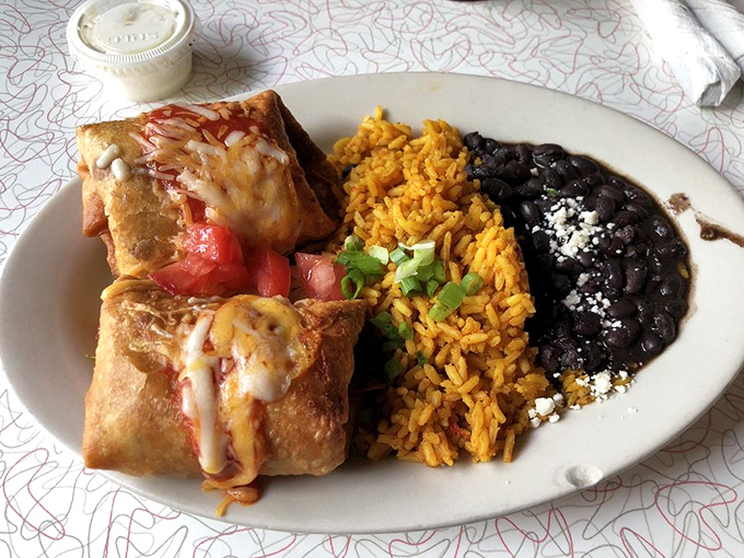 Chimichangas: where burritos go to fulfill their destiny. Crispy, golden, and flanked by rice and beans like loyal courtiers.