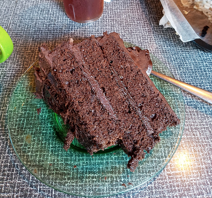 Chocolate cake so rich it should come with its own tax bracket. The kind of dessert that demands you slow down and savor.