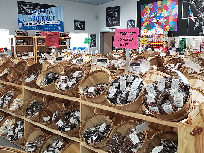 Chocolate-covered nuts nestled in rustic wooden baskets. Each carefully labeled variety promises a perfect marriage of crunch and cocoa bliss.