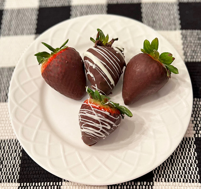 Chocolate-dipped strawberries: nature's candy getting dressed up for a night on the town. Formal wear never tasted so juicy.